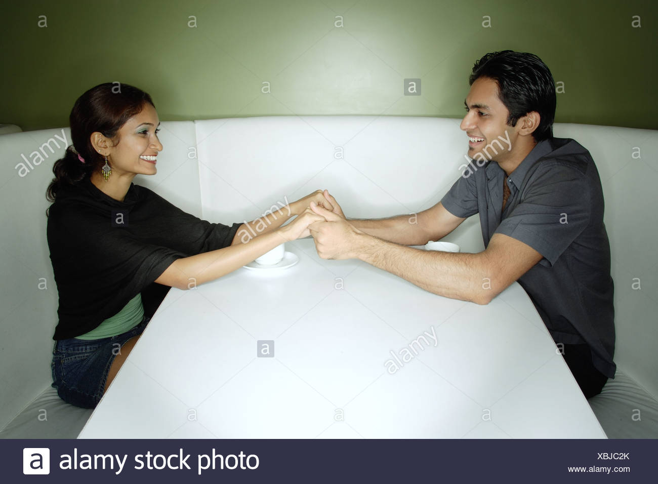 Young Couple Sitting Opposite Other High Resolution Stock Photography ...