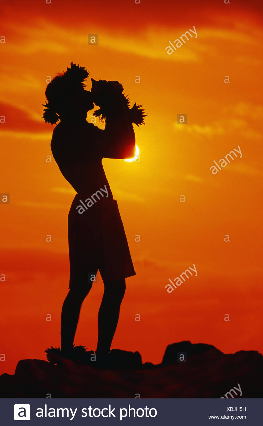 Hawaiian Man Blowing Conch Shell High Resolution Stock Photography and ...