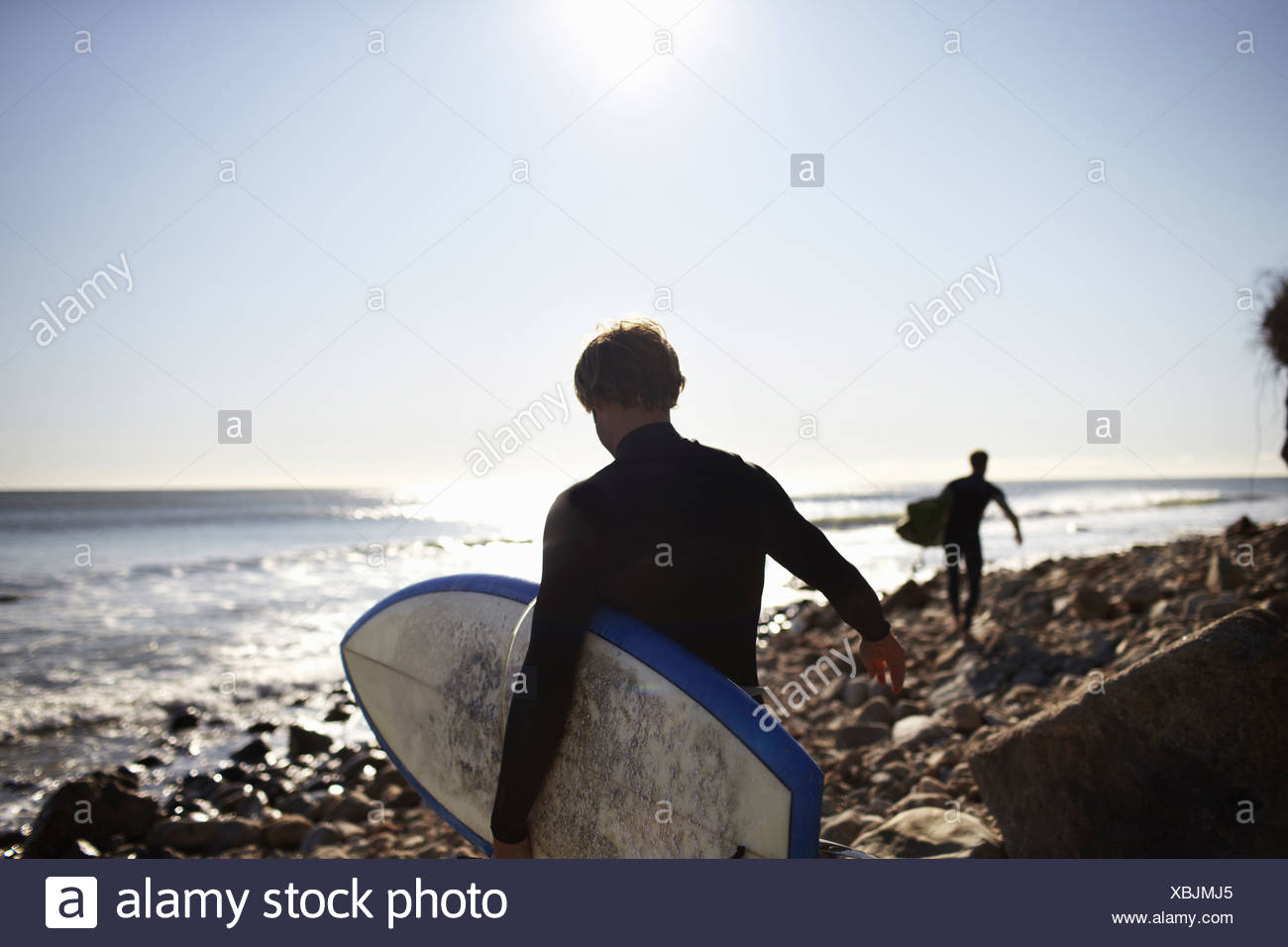 Surfing Couple On Beach High Resolution Stock Photography and Images ...