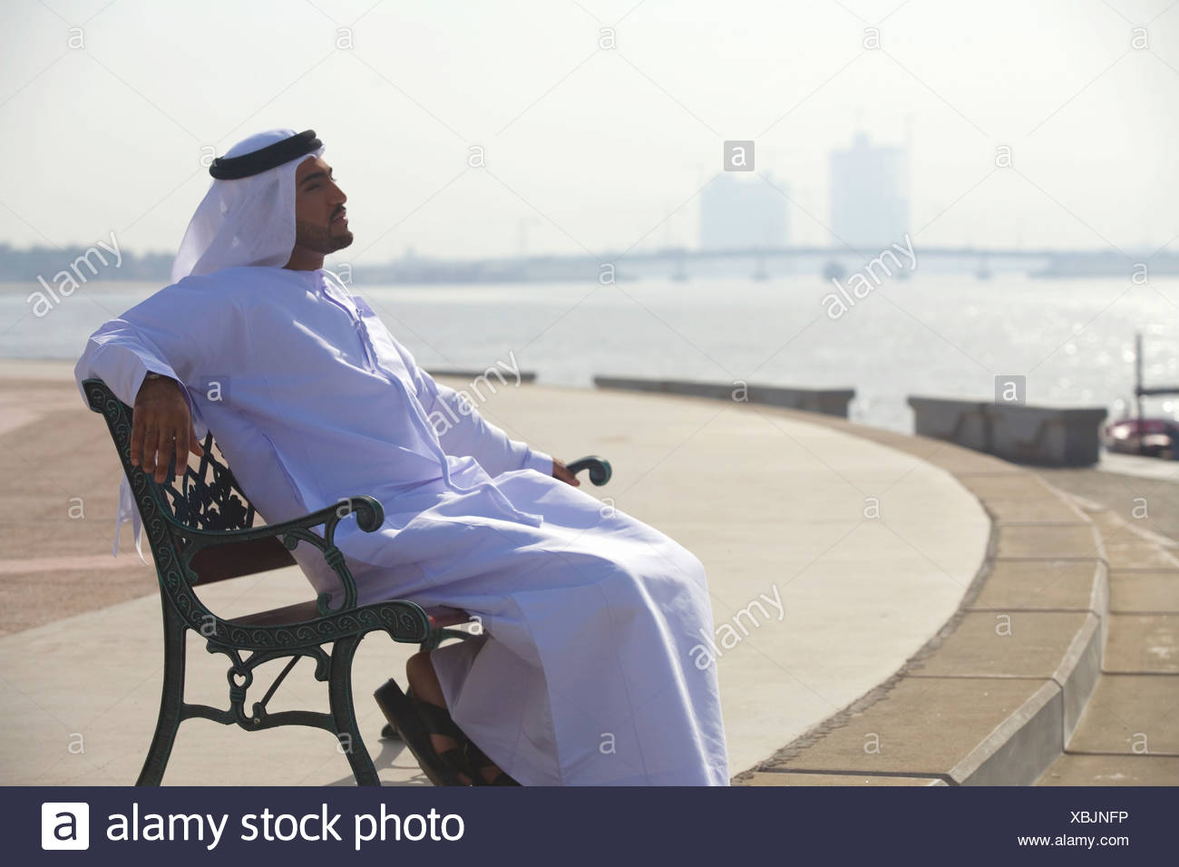 Arab Man Sitting On Park Bench High Resolution Stock Photography and ...