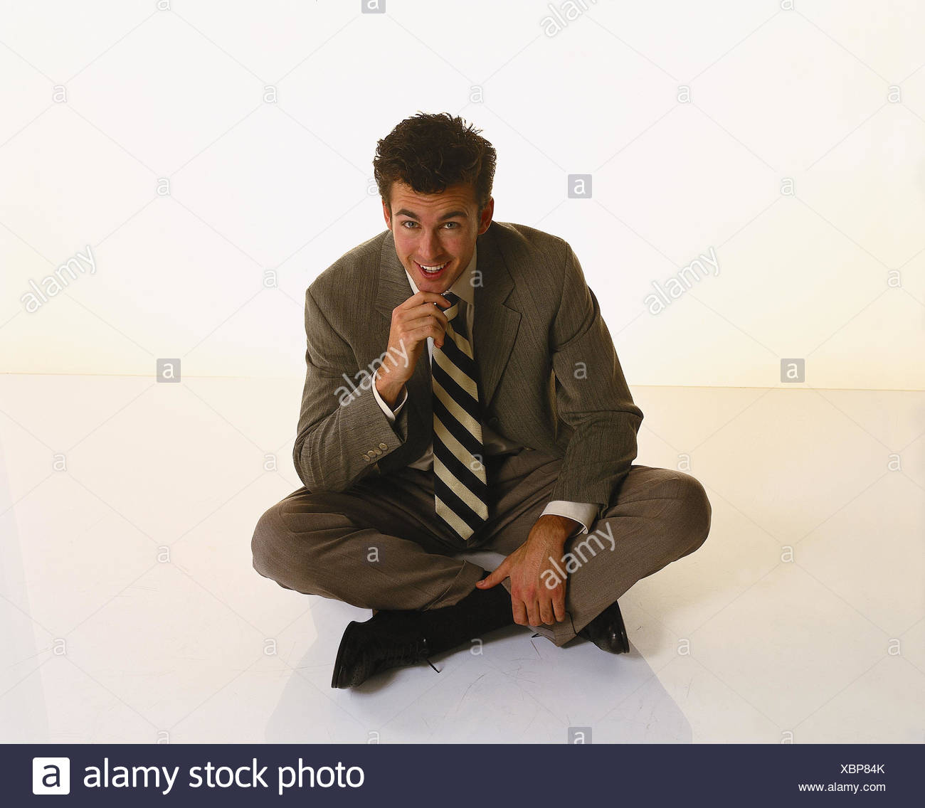 Man Cross Legged Suit High Resolution Stock Photography and Images - Alamy