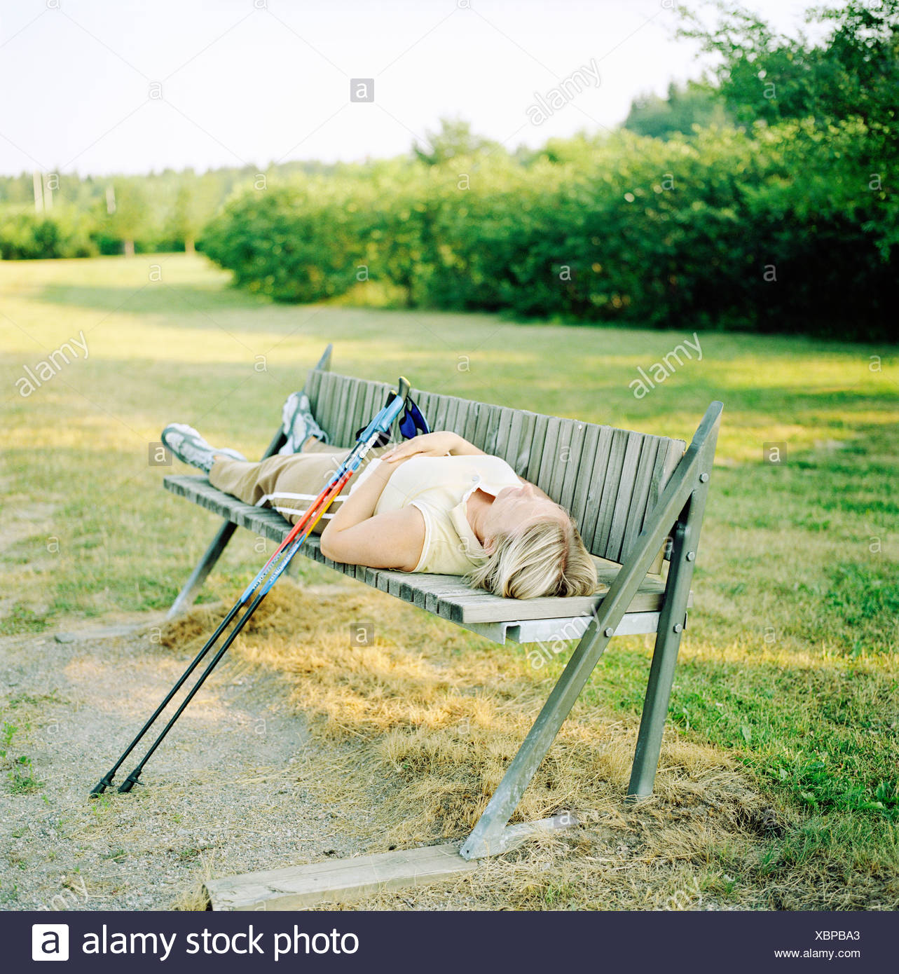 Woman Is Lying On A Bench High Resolution Stock Photography and Images ...