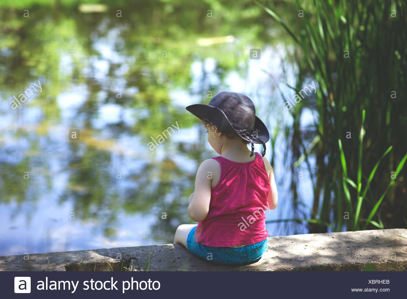 Girl At Pond High Resolution Stock Photography and Images - Alamy