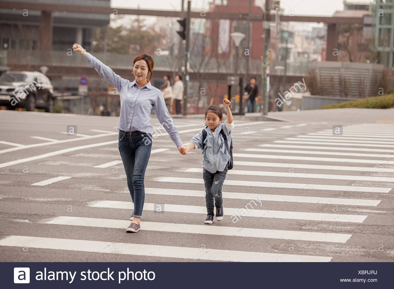 Family Crossing Crosswalk Holding Hands High Resolution Stock ...