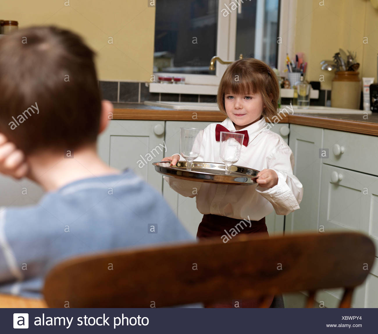 Sister Helping Brother Get Dressed High Resolution Stock Photography ...
