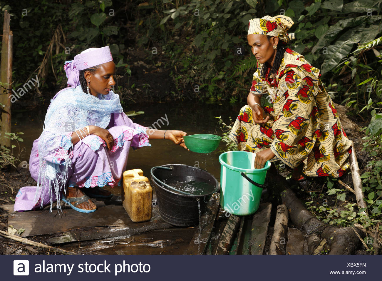 Woman Fetching Water High Resolution Stock Photography and Images - Alamy