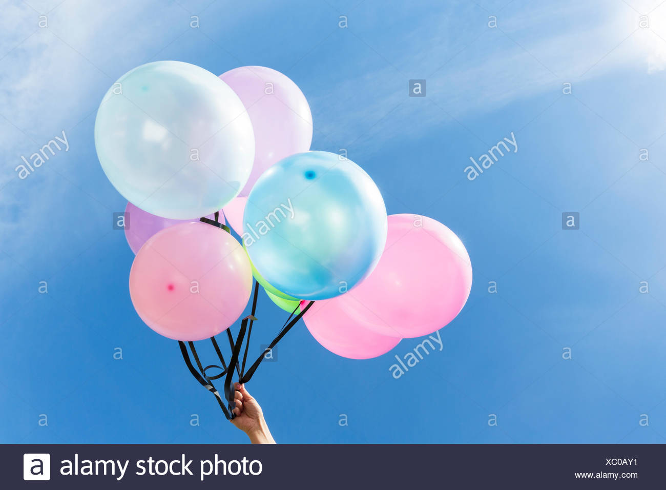 Hand Holding Balloons High Resolution Stock Photography and Images - Alamy