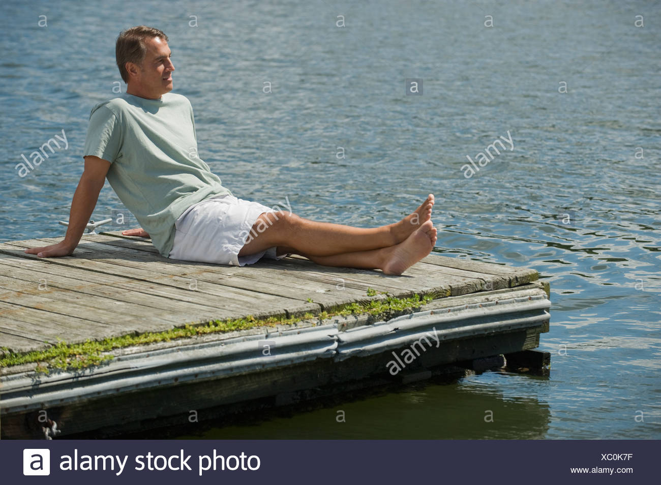 Man Sitting On Dock High Resolution Stock Photography and Images - Alamy