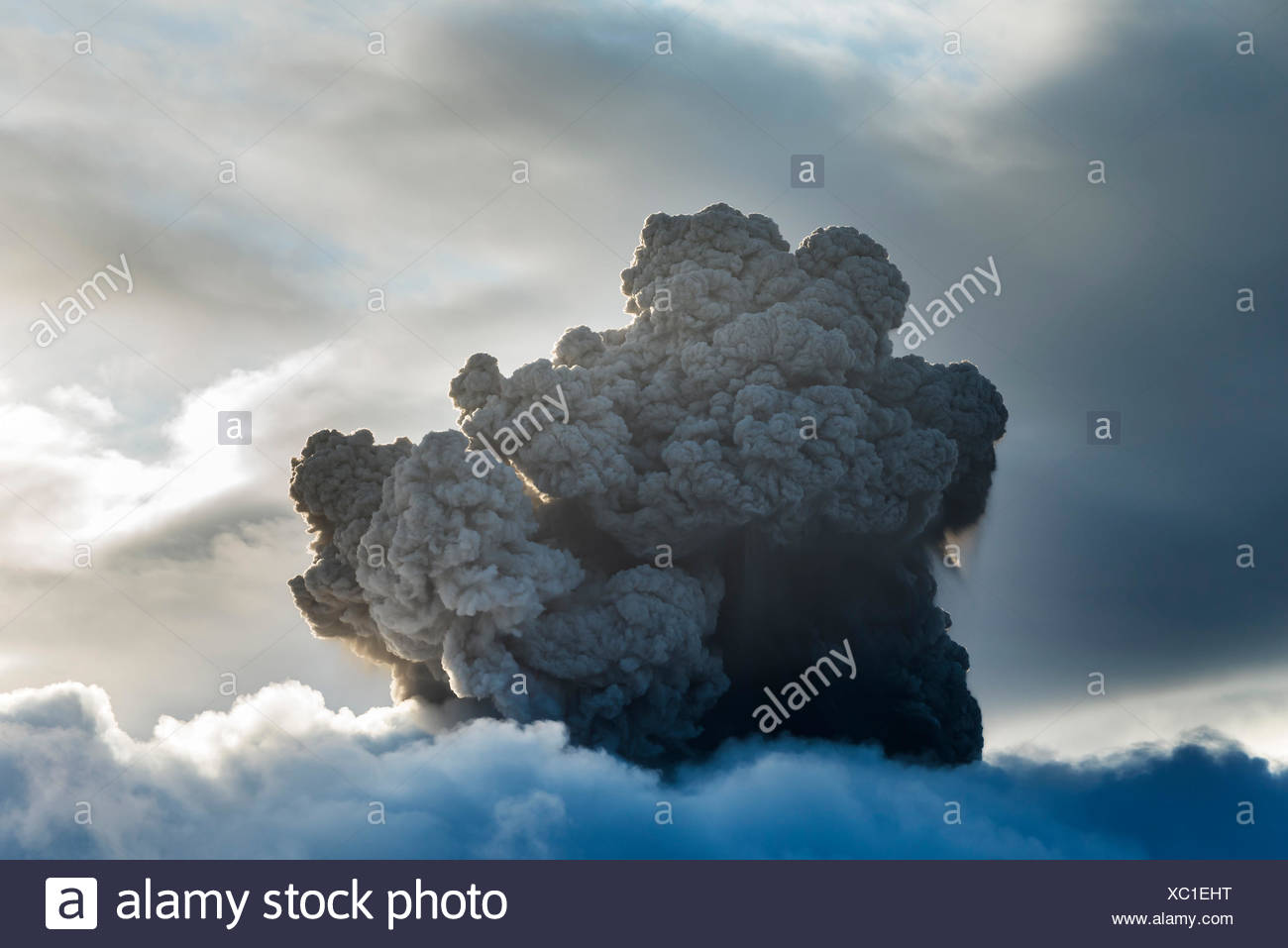 Rises Dramatically Over The Cloud Cover High Resolution Stock ...