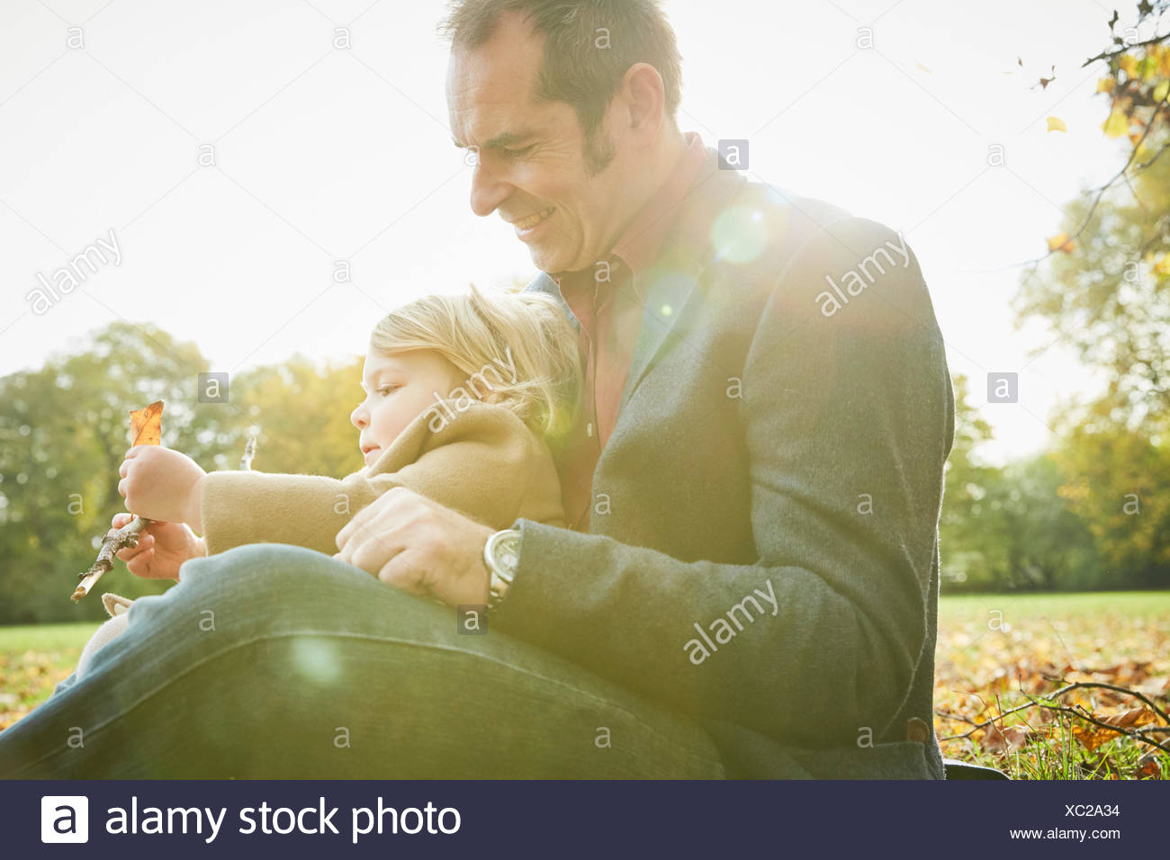 Daughter Sitting On Fathers Lap High Resolution Stock Photography and ...
