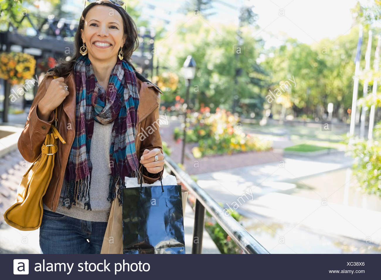 Woman Carrying Shopping Bags Stock Photos & Woman Carrying Shopping ...