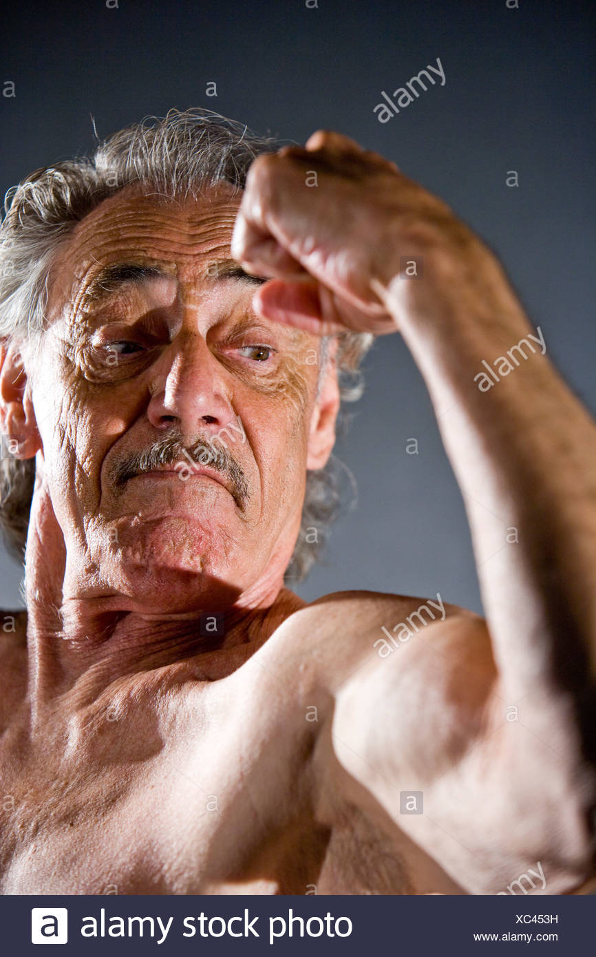 Senior Man Flexing Muscle Stock Photos & Senior Man Flexing Muscle ...
