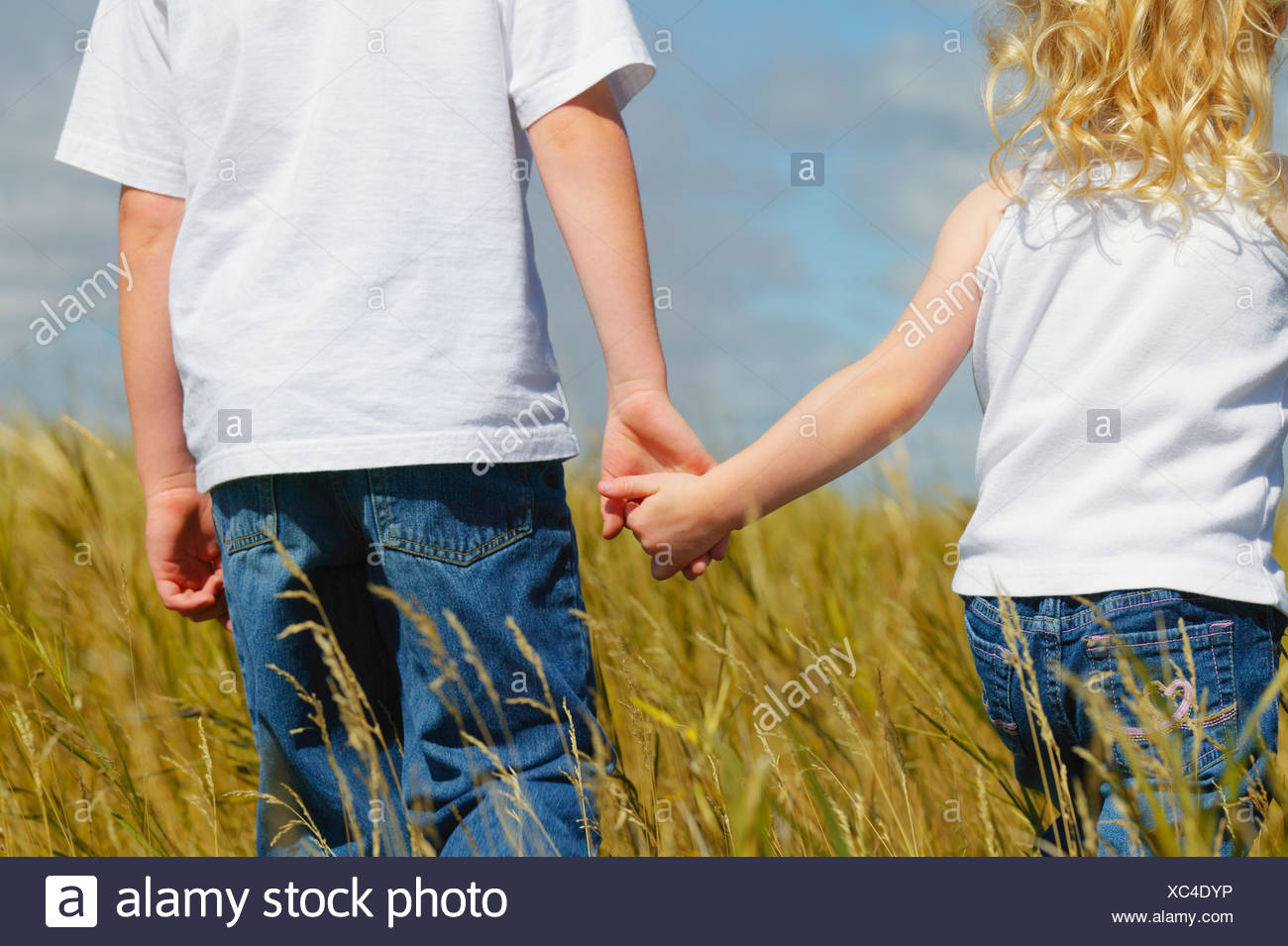 Toddler Holding Her Hands Behind Her Back High Resolution Stock ...