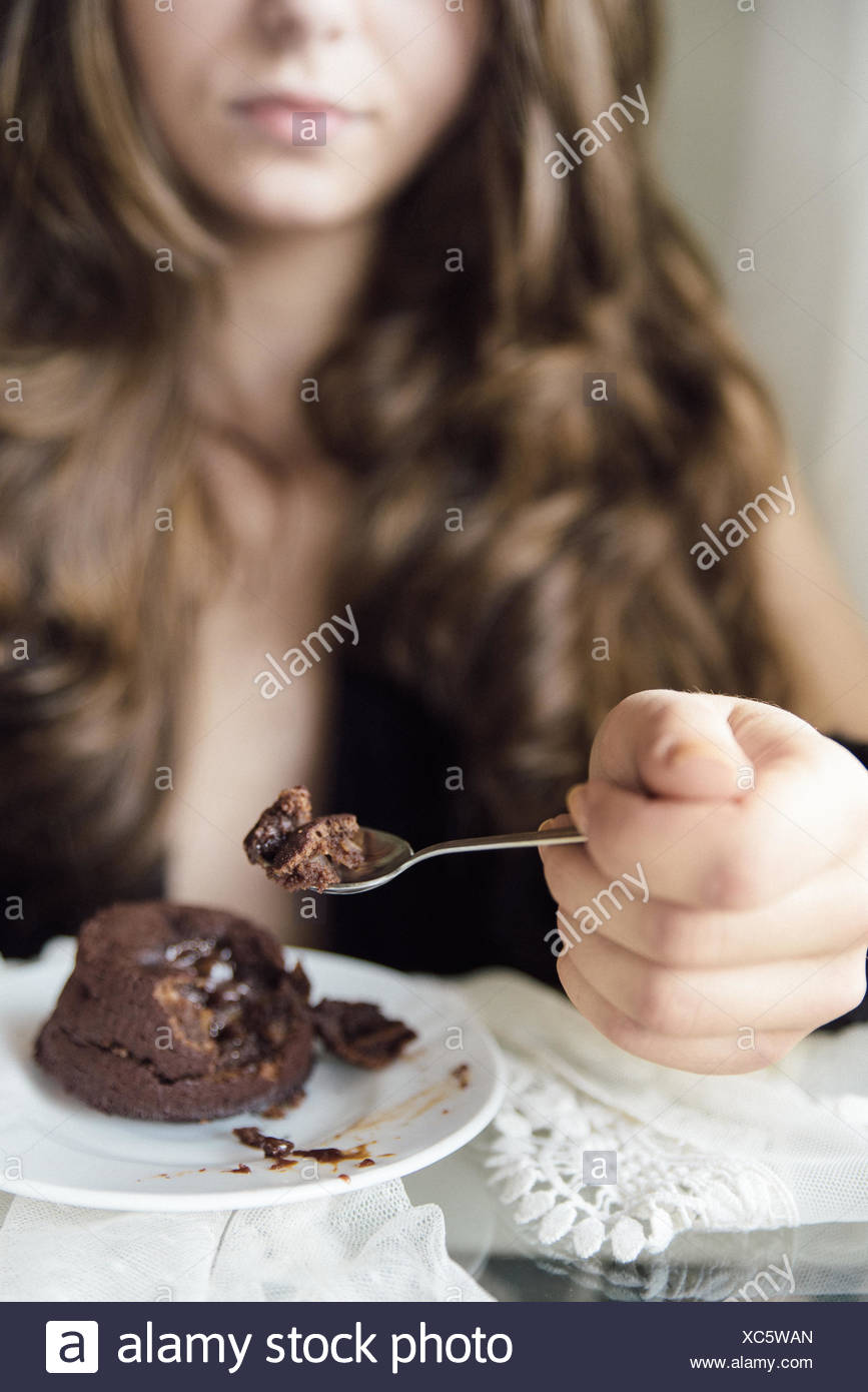 Woman Eating A Chocolate High Resolution Stock Photography and Images ...