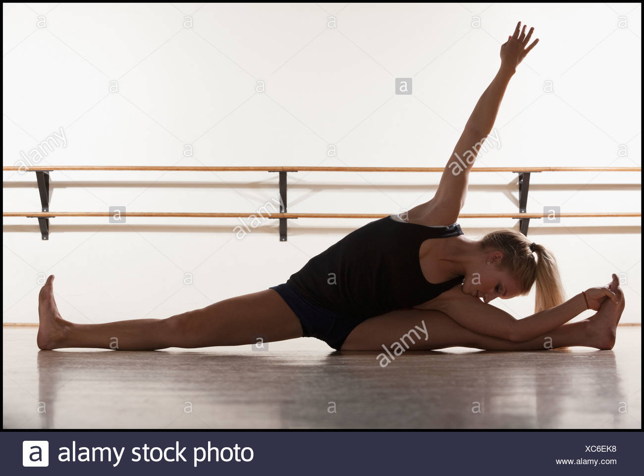 Flexible Young Ballet Dancer Stretching Stock Photos & Flexible Young ...