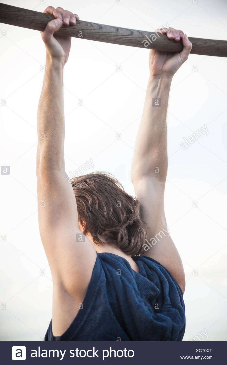 Hanging By One Arm High Resolution Stock Photography and Images - Alamy