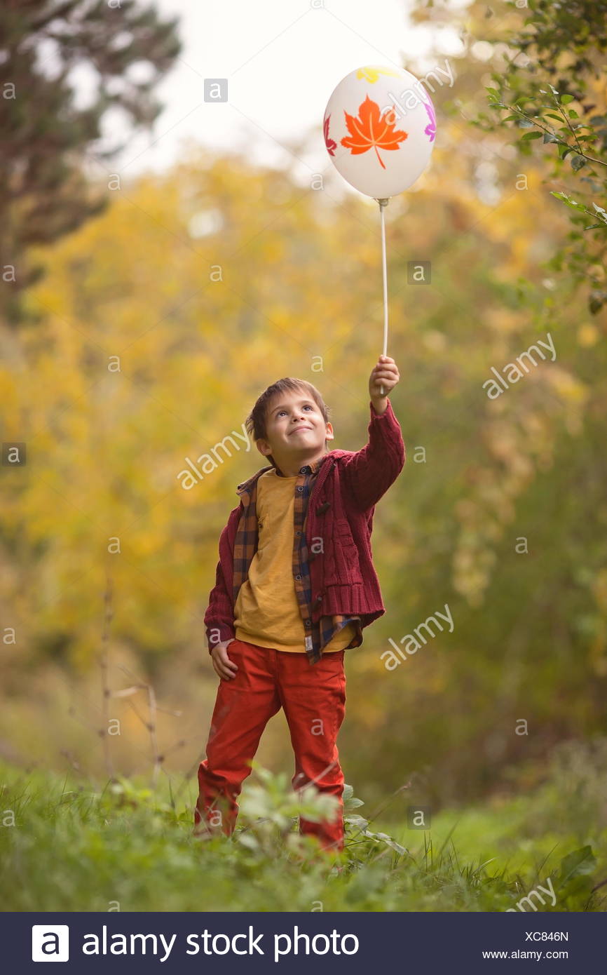 Child Holding Balloon High Resolution Stock Photography and Images - Alamy