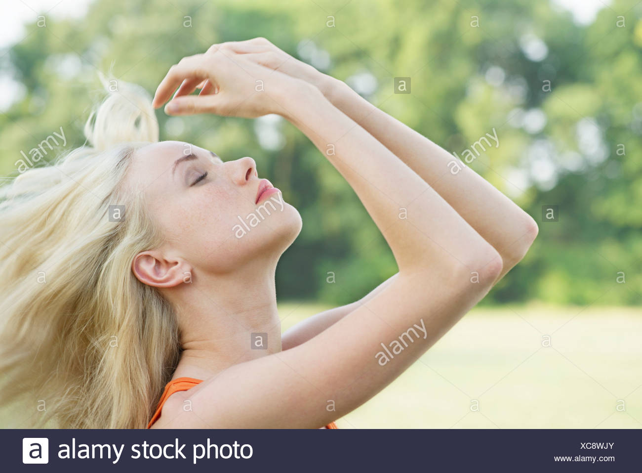 Blond Woman Throwing Head Back Stock Photos & Blond Woman Throwing Head ...