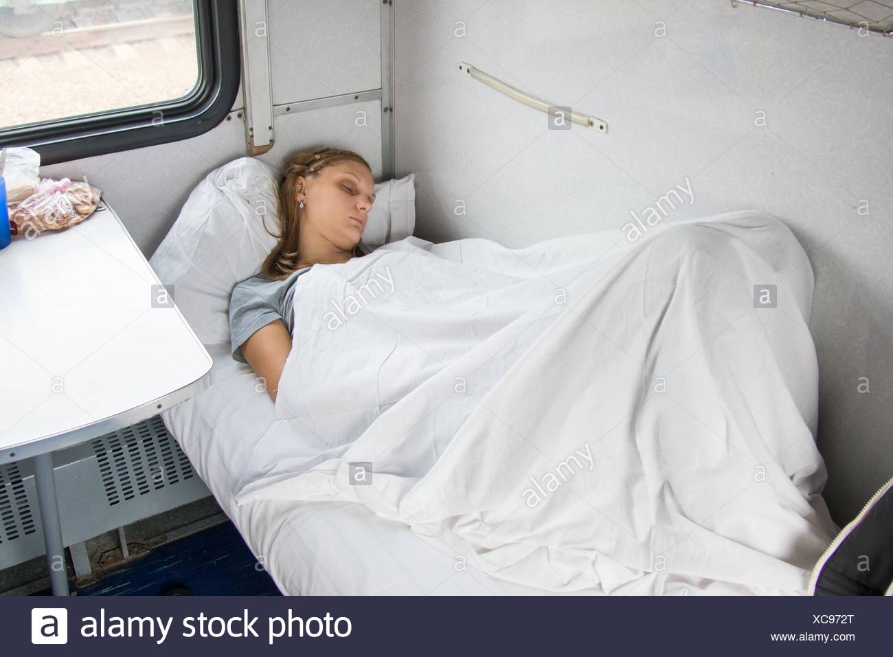 Girl Sleeping On Train High Resolution Stock Photography and Images - Alamy