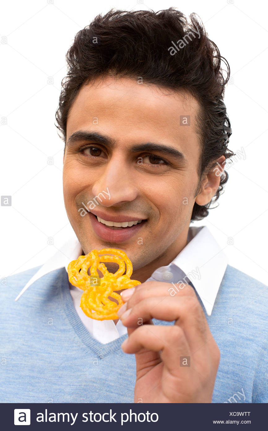 Indian Man Eating Sweet High Resolution Stock Photography and Images ...