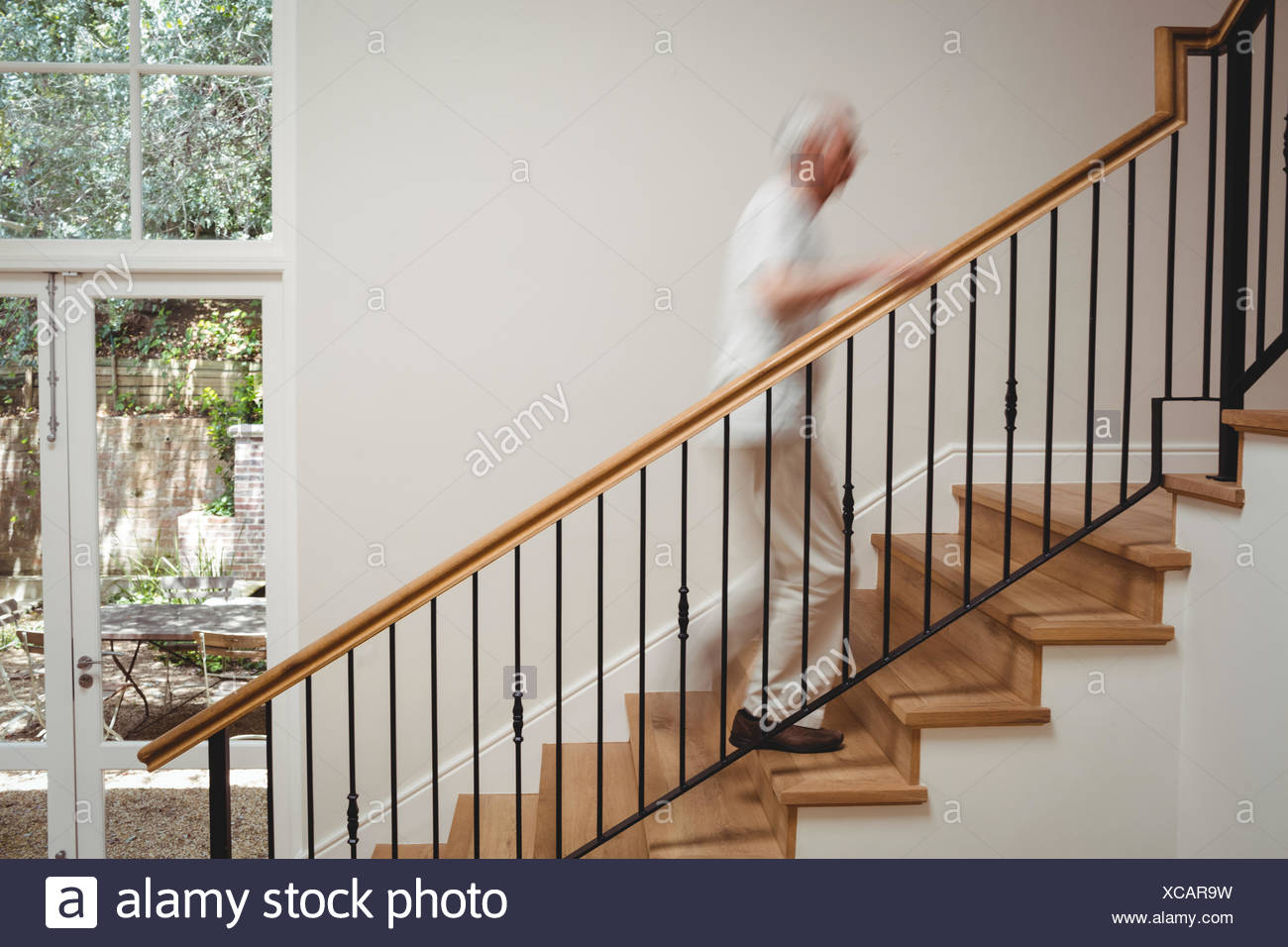 Man Walking Up Apartment Stairs High Resolution Stock Photography and ...