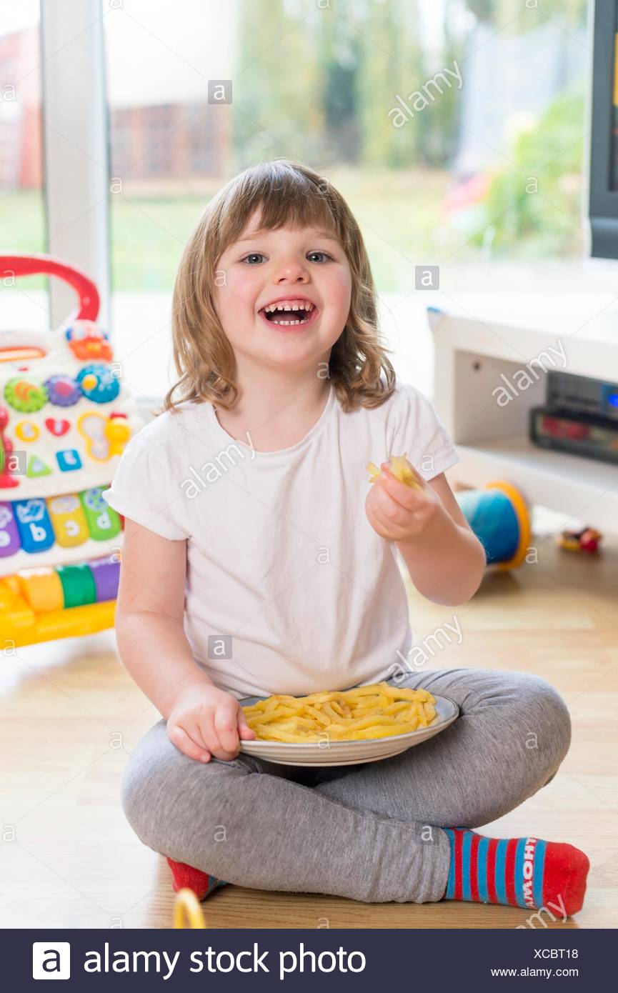 Girl Eating French Fries High Resolution Stock Photography and Images ...