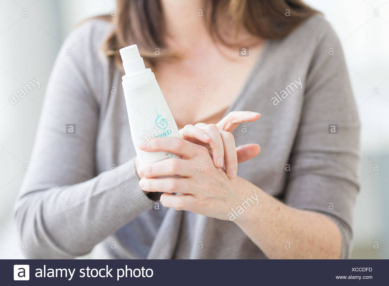 Woman Applying Estrogen Gel On High Resolution Stock Photography and ...