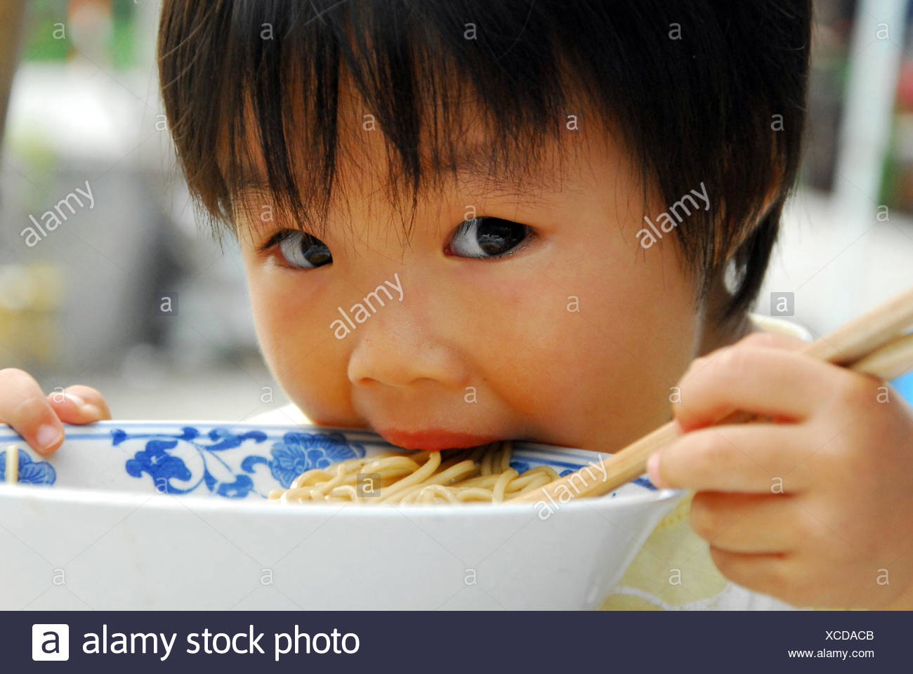 Girl Eating Noodles High Resolution Stock Photography and Images - Alamy