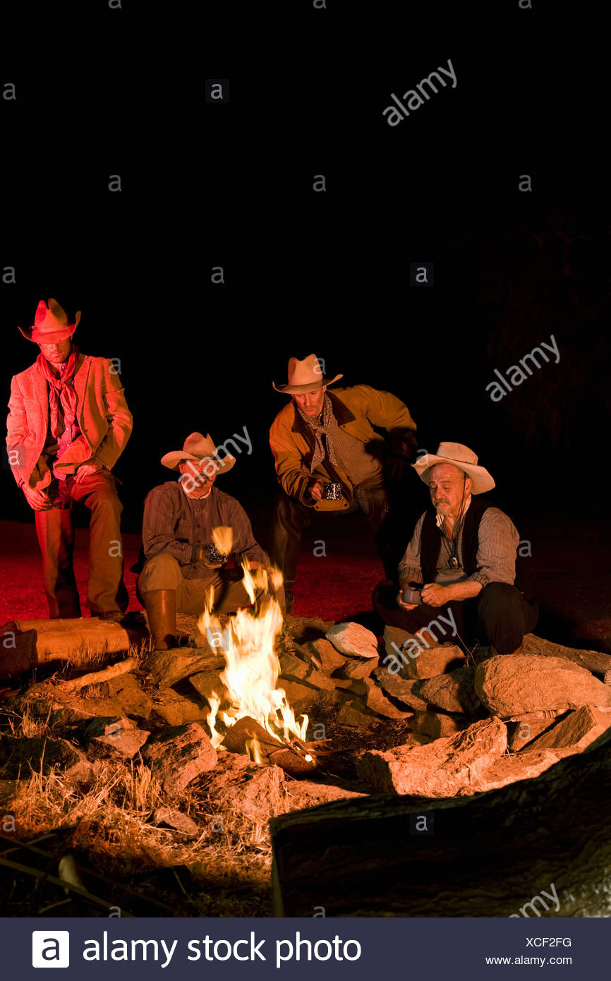 Cowboys Sitting Around Campfire Night High Resolution Stock Photography ...