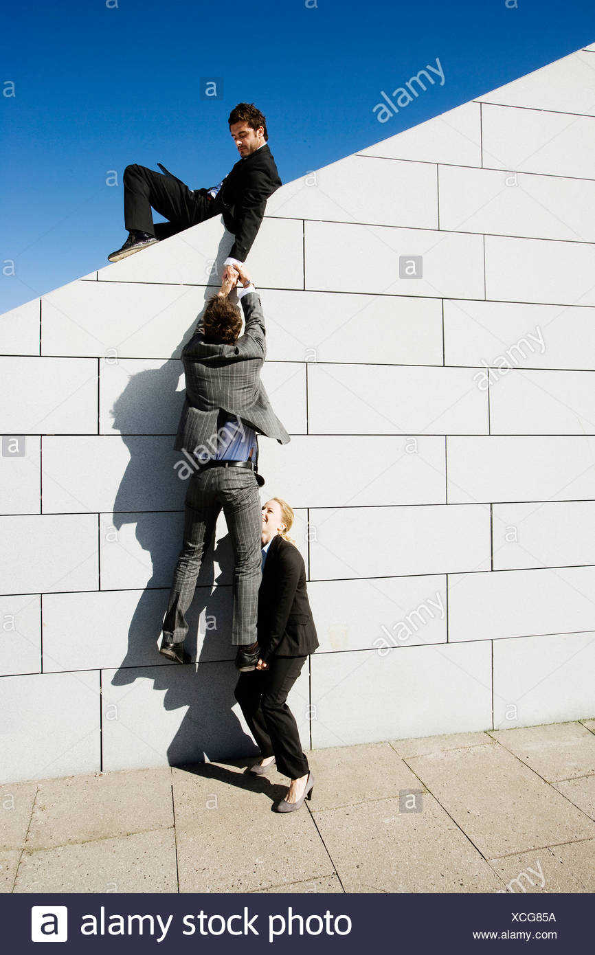 Woman Climbing Over Wall High Resolution Stock Photography and Images ...