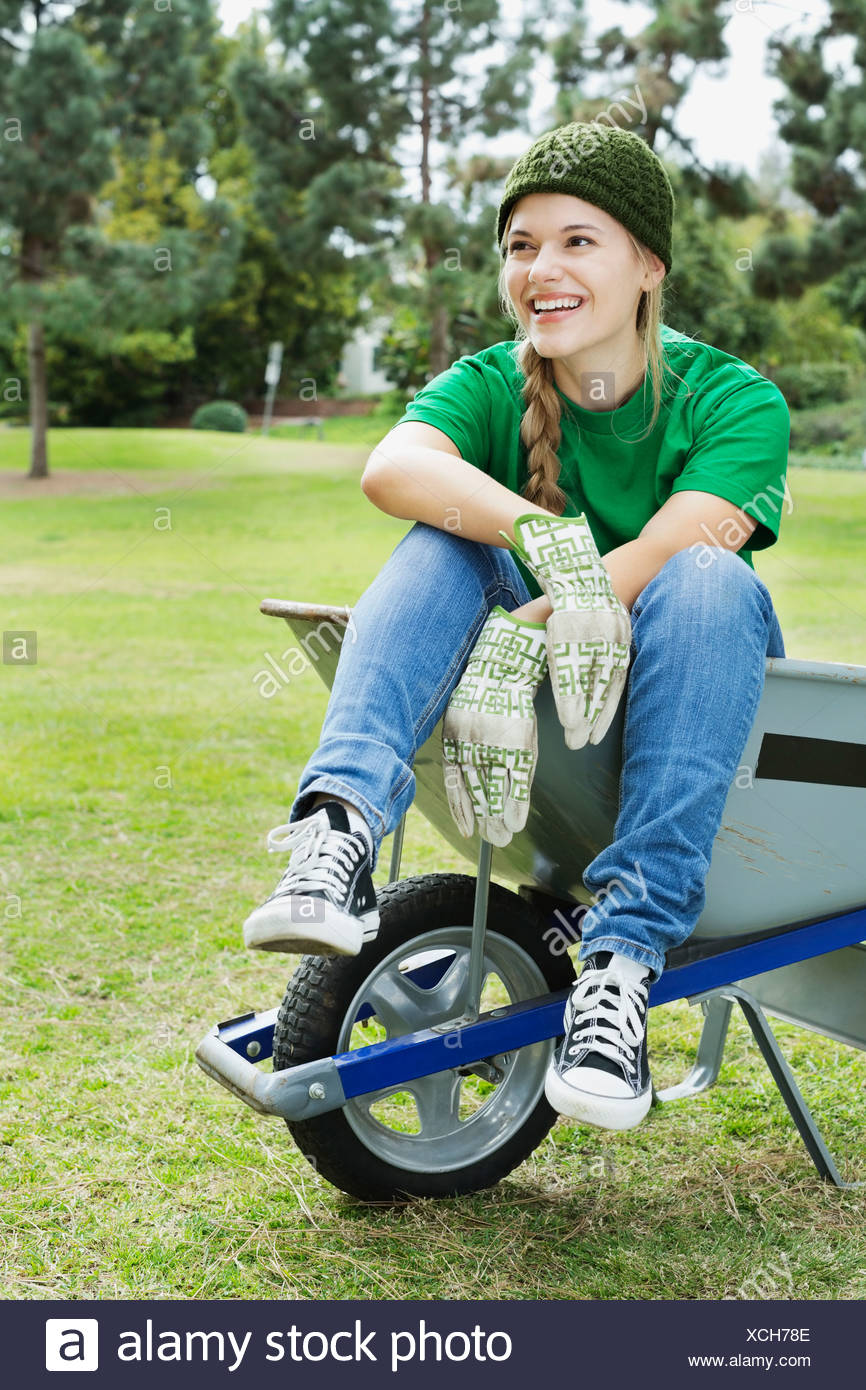 He Is Sitting In The Wheelbarrow Stock Photos & He Is Sitting In The ...