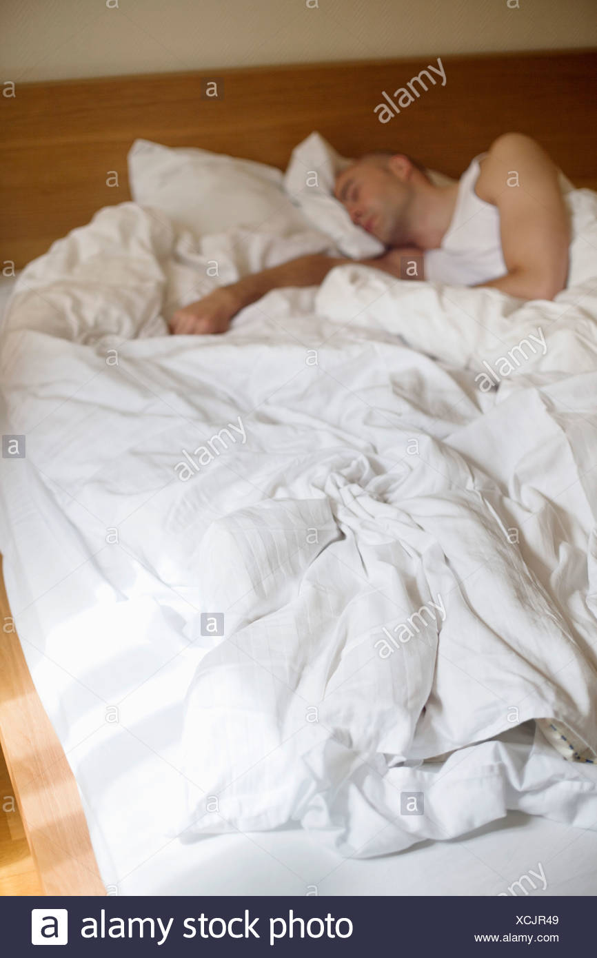 One Man Sleeping In Bed High Resolution Stock Photography and Images ...
