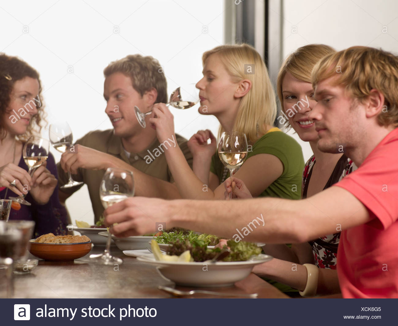 Side View Men Sitting Dining Stock Photos & Side View Men Sitting ...