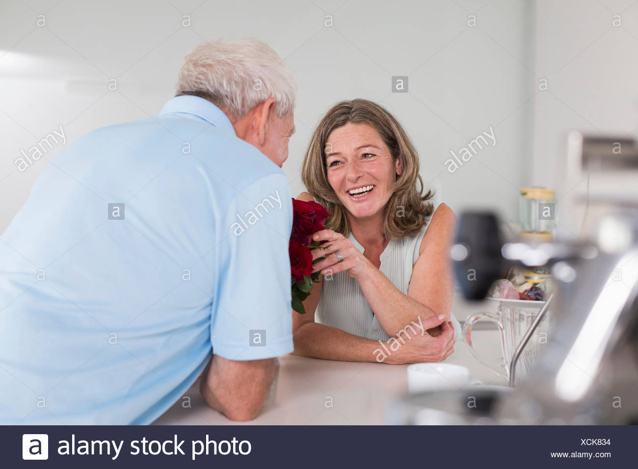 Man Giving Flowers To Woman High Resolution Stock Photography and ...