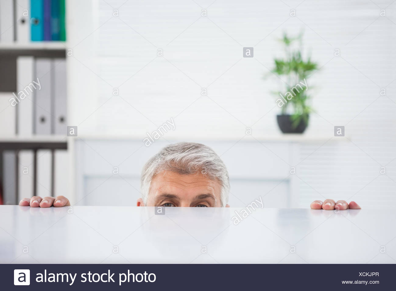 Peeking Over Desk High Resolution Stock Photography and Images - Alamy