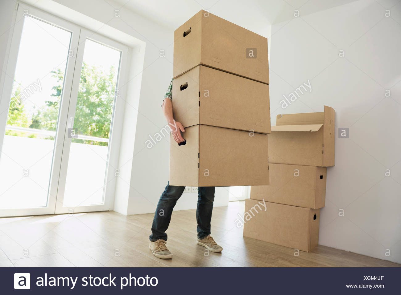 Man Carrying Heavy Boxes Moving House High Resolution Stock Photography ...