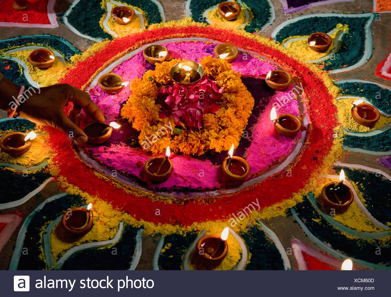 Diya And Hand High Resolution Stock Photography and Images - Alamy