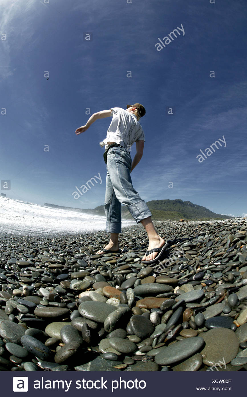 Throwing A Stone Into The Sea High Resolution Stock Photography and ...