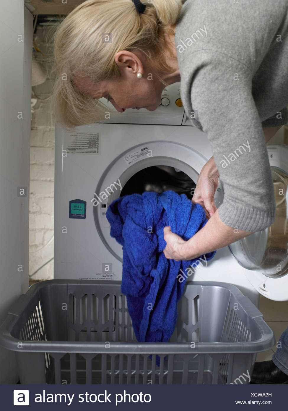 Woman Removing Clothes High Resolution Stock Photography and Images - Alamy