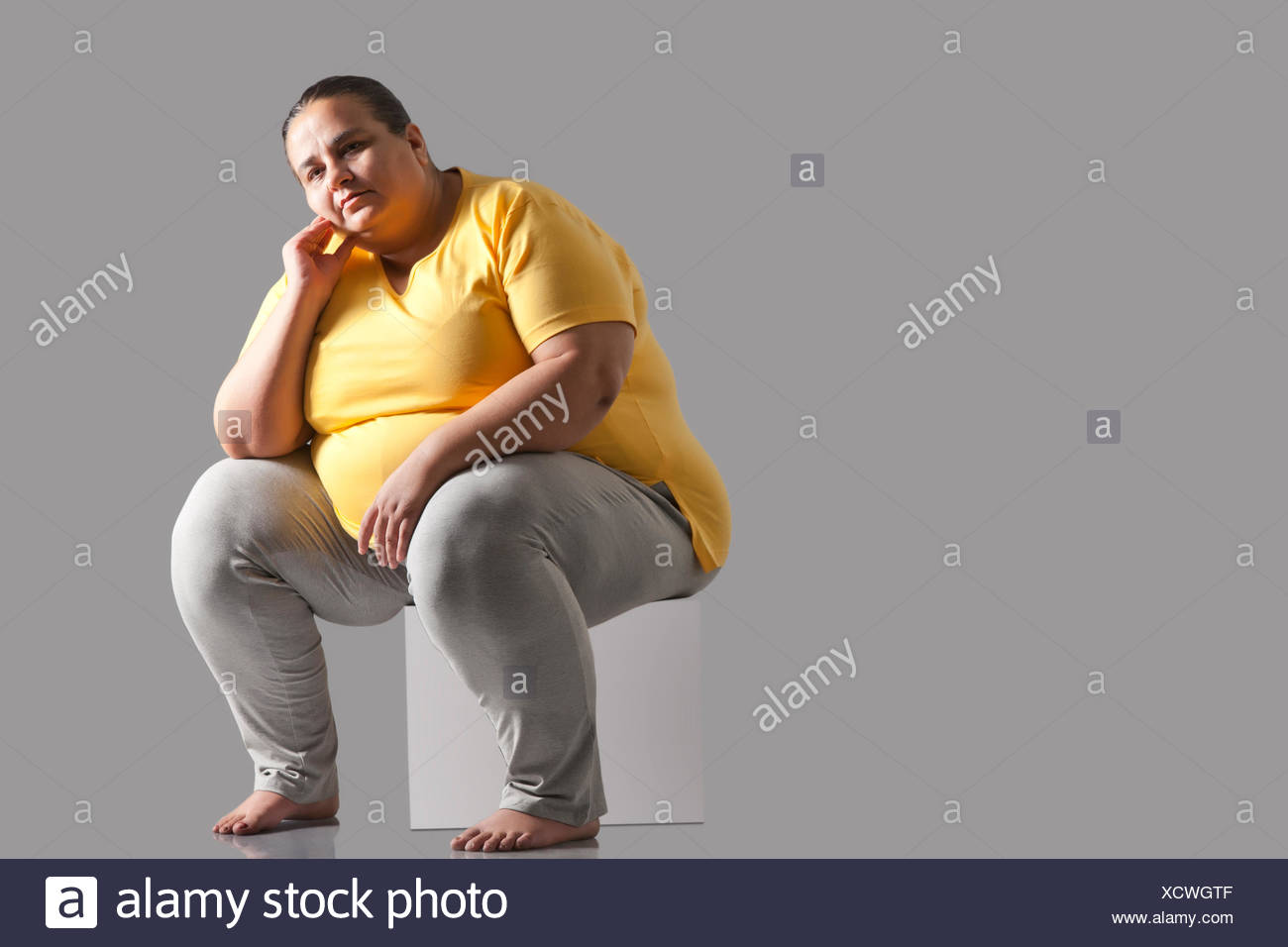 Obese Woman Sitting Stock Photos & Obese Woman Sitting Stock Images - Alamy