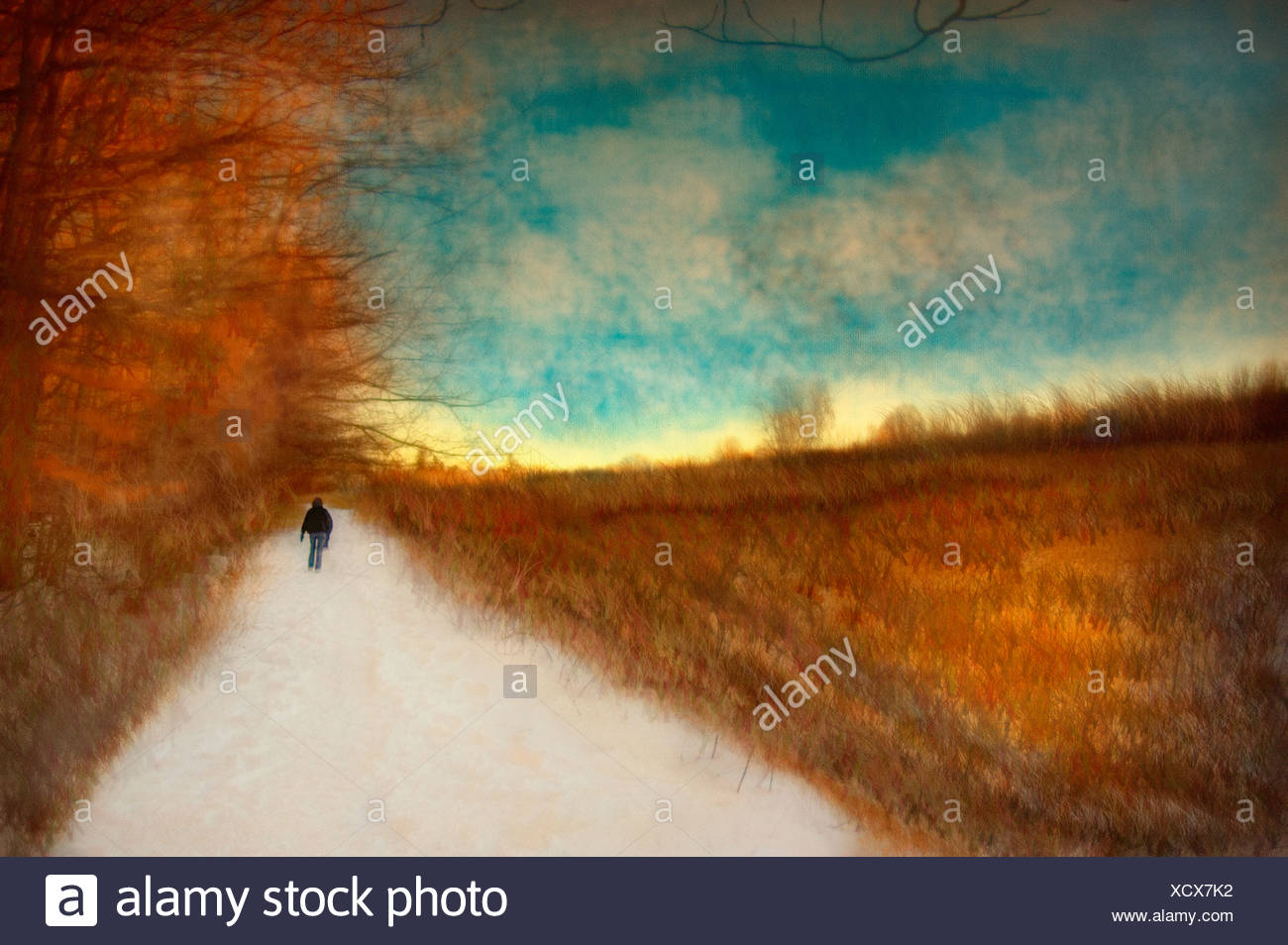 Lonely Figure In Blue Walking Into Distance High Resolution Stock ...