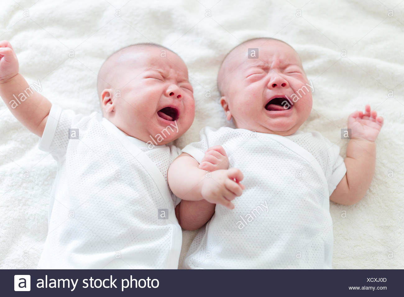 Crying Baby Twins Stock Photos & Crying Baby Twins Stock Images - Alamy