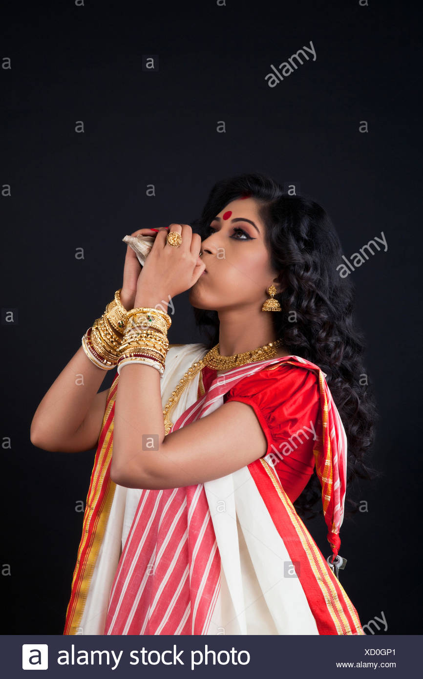 Blowing The Conch Shell High Resolution Stock Photography and Images ...