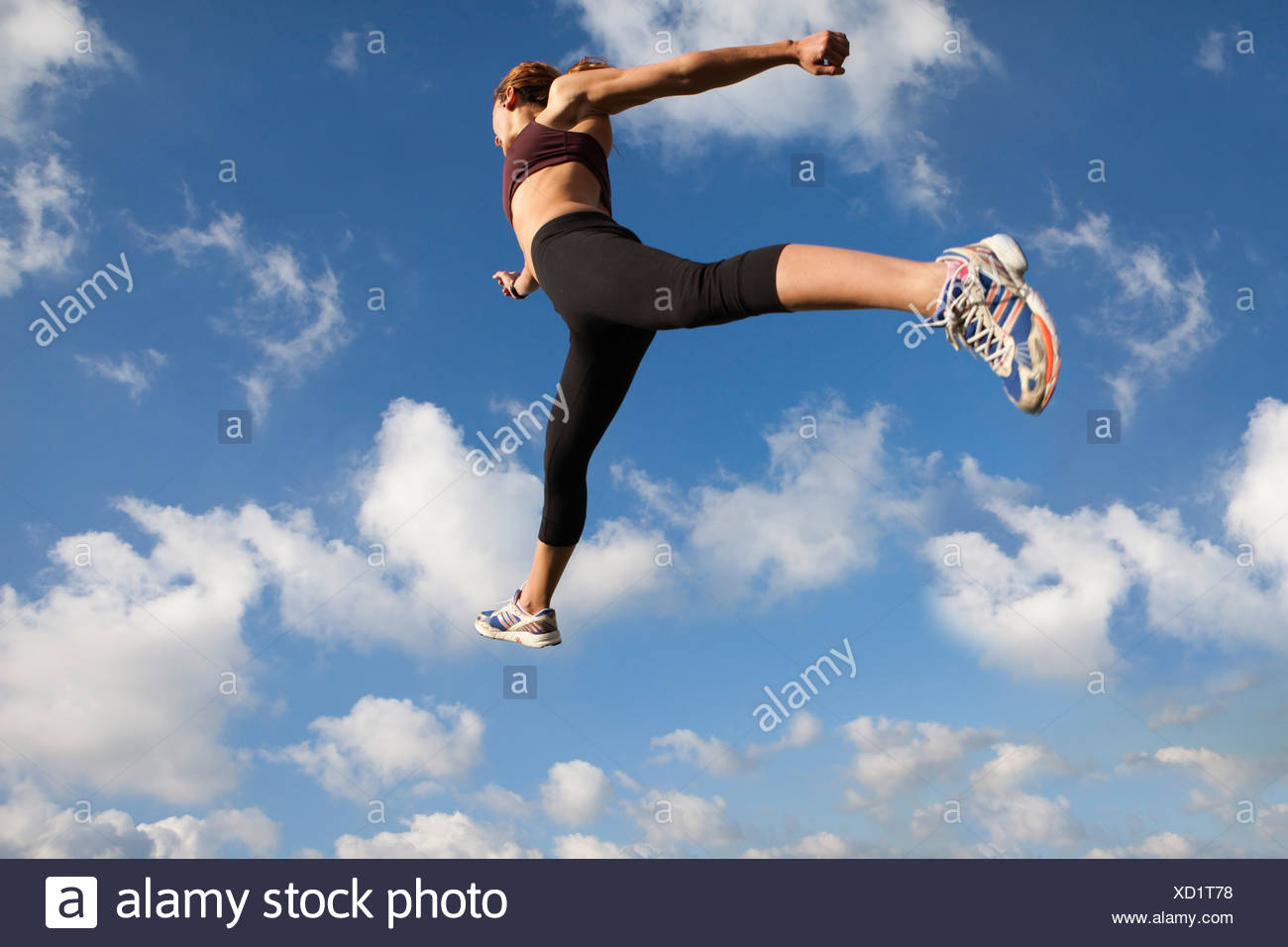 Woman Jumping In Midair High Resolution Stock Photography and Images ...