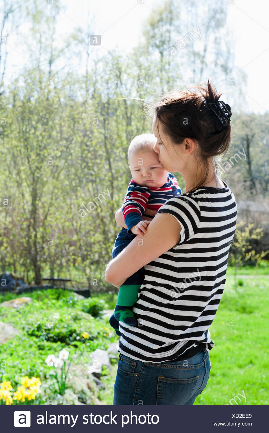 Child Carrying Baby On Back High Resolution Stock Photography and ...