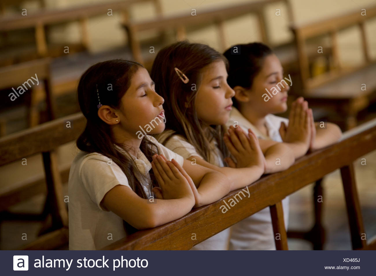 Girl Kneeling Praying In Church High Resolution Stock Photography and ...
