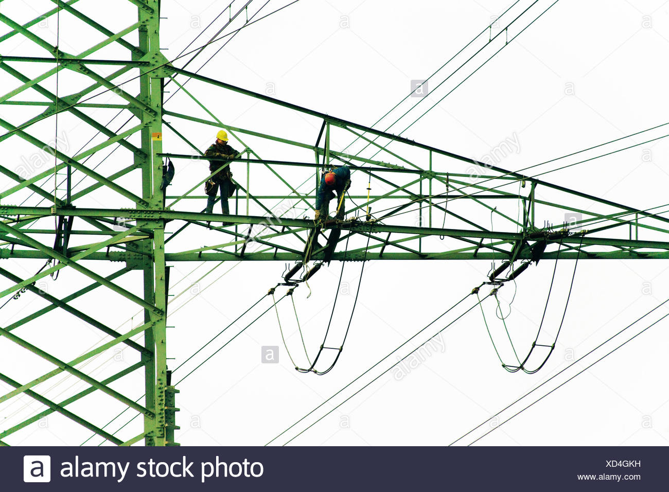 Man Working On High Voltage Power Lines High Resolution Stock ...