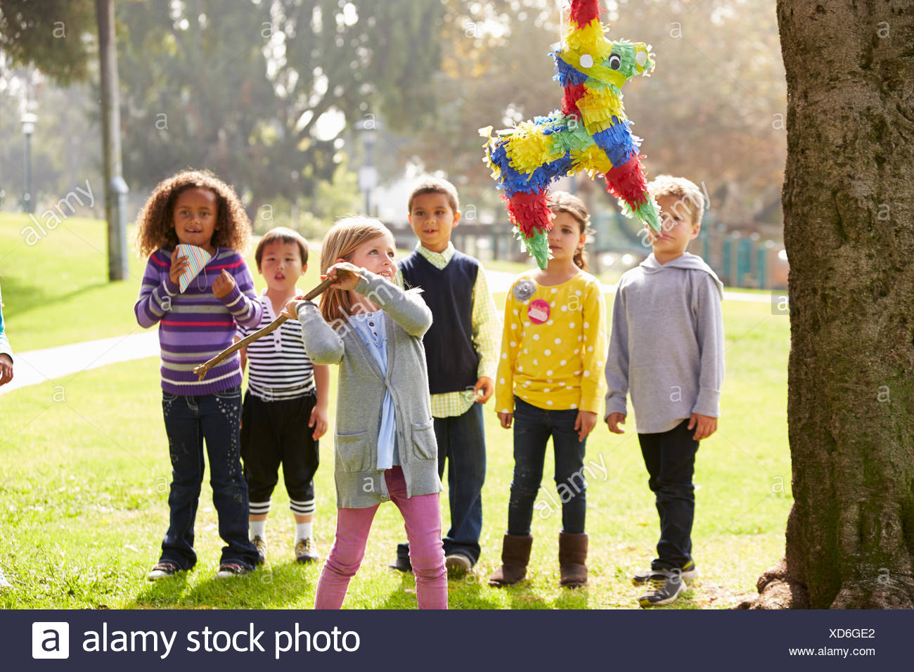 Children Hitting Pinata At Birthday Party Stock Photo: 283501066 - Alamy