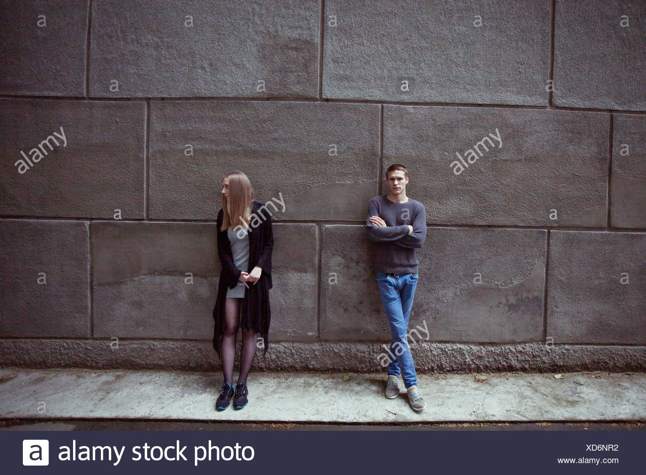 Woman Leaning Against Wall Arms Crossed Stock Photos & Woman Leaning ...