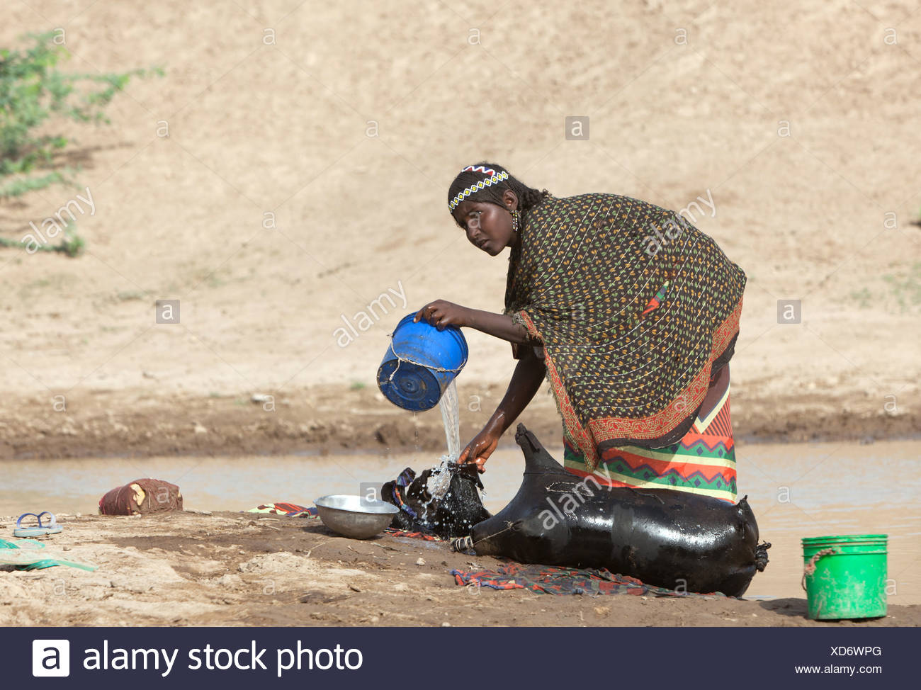 People Fetching Water High Resolution Stock Photography and Images - Alamy